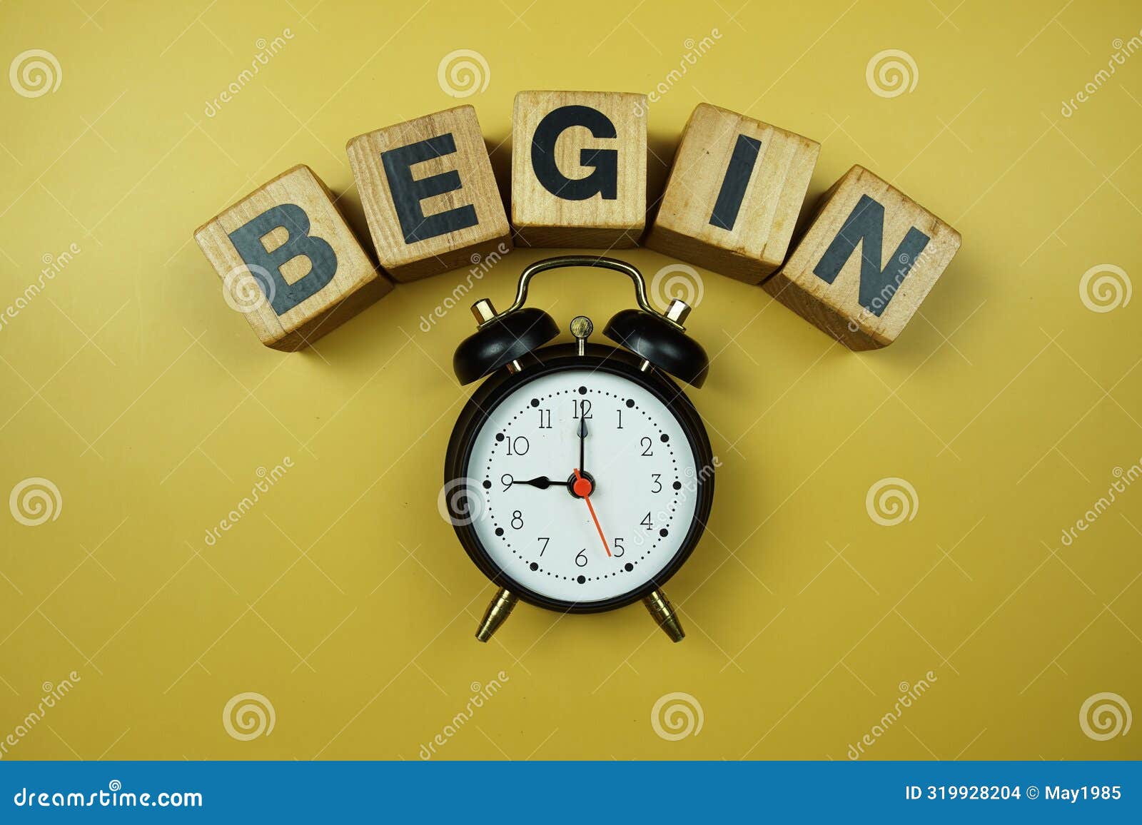Begin Word and Alarm Clock Top View on Yellow Background Stock Photo ...
