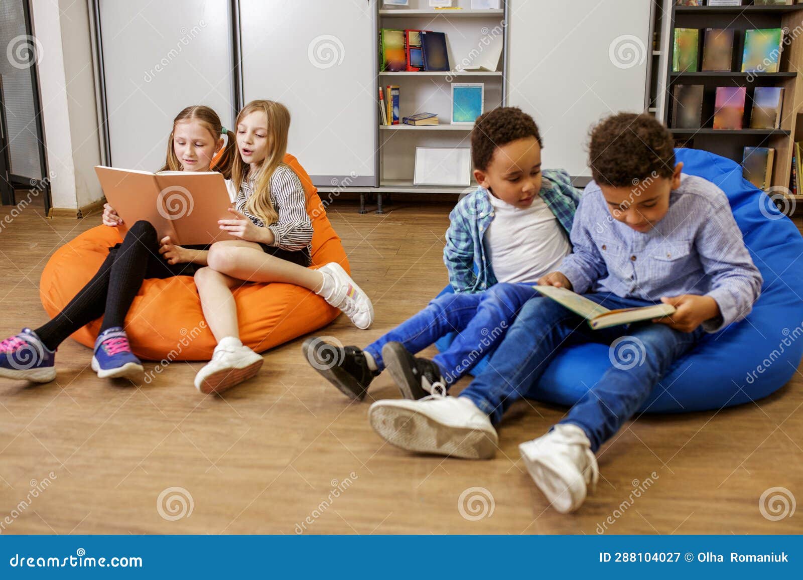 Children Reading Book in Classroom. Back To School. Beginning of School ...