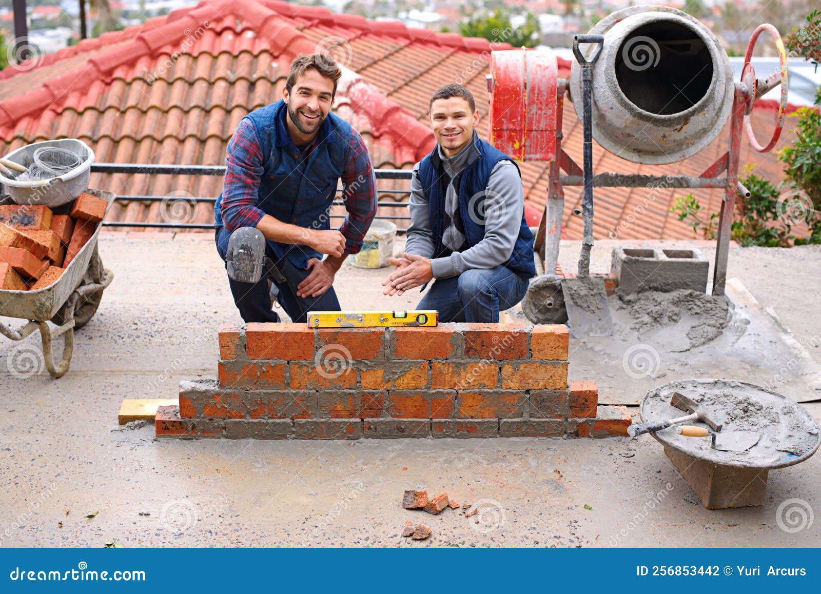 The Beginnings of a Sound Foundation. Portrait of Bricklayers at Work ...