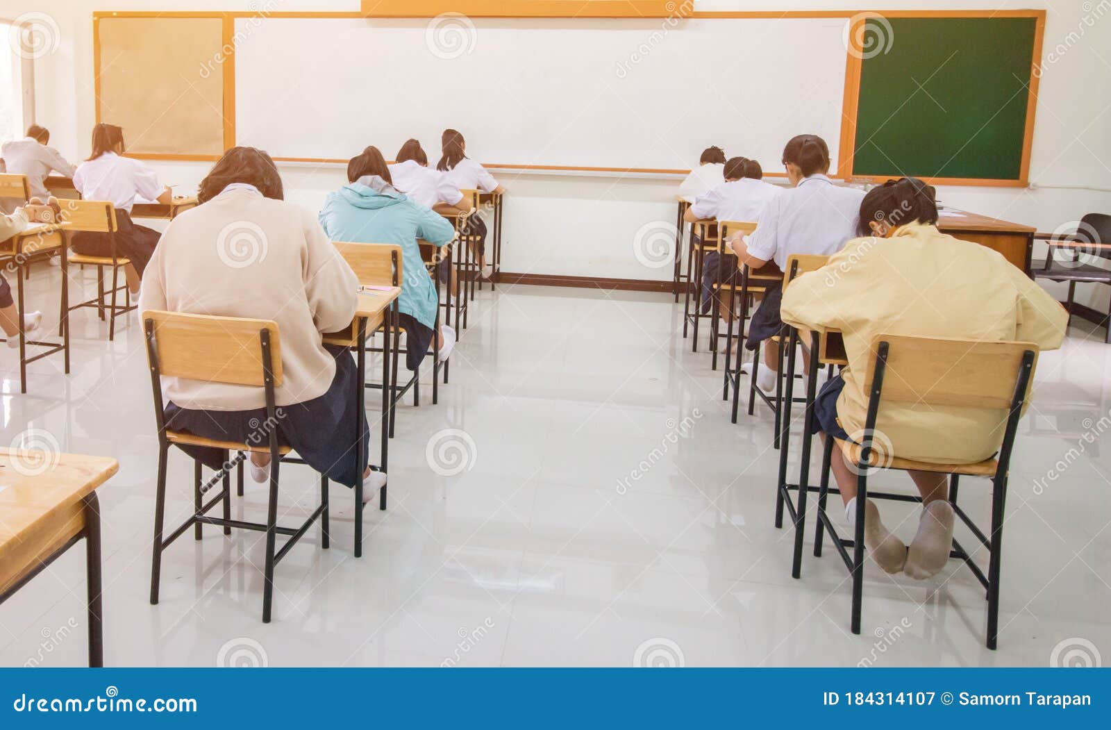Behind Asian School Students in Uniform Taking Examination and Writing ...