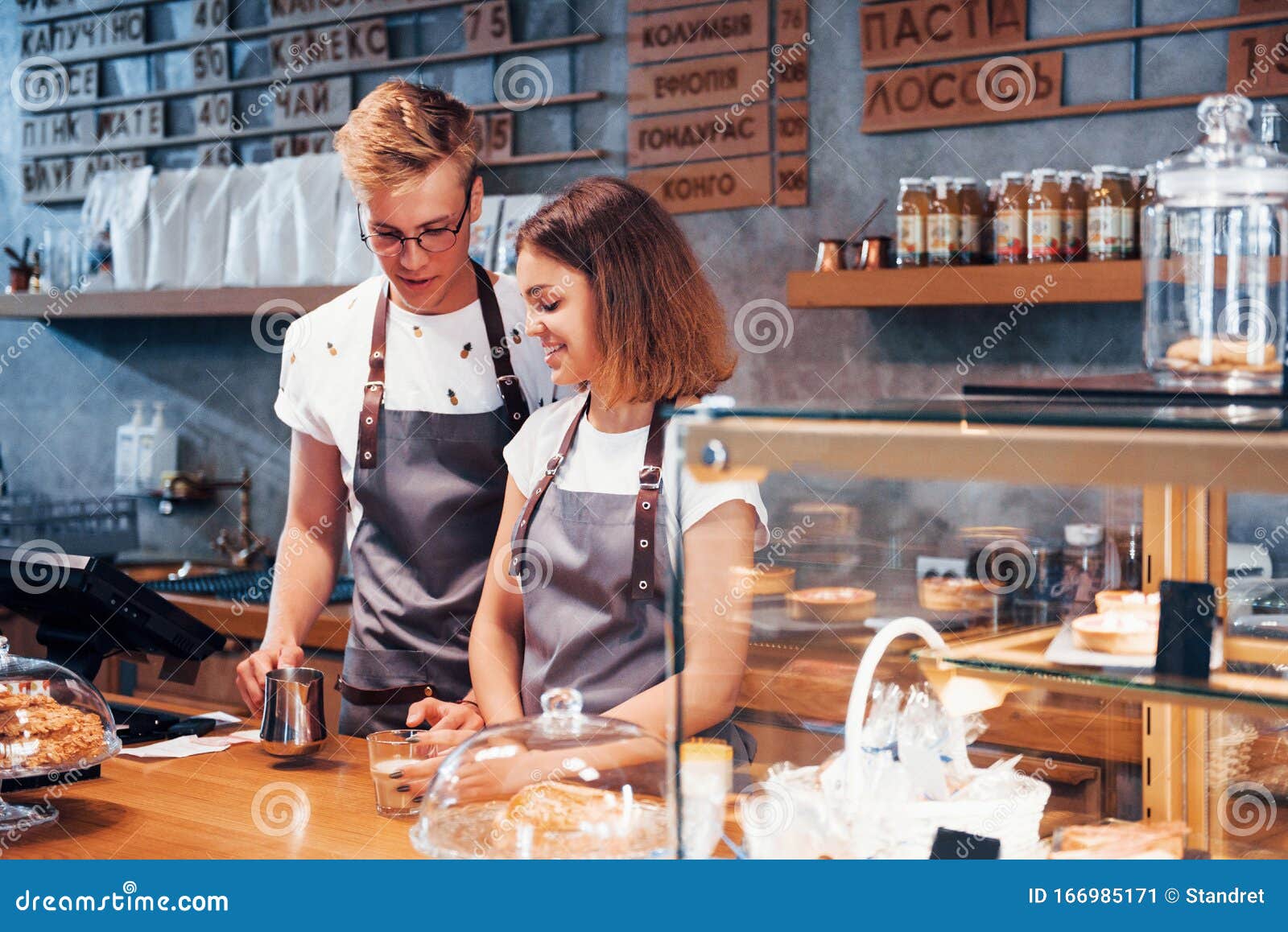 Behind the Bar. Two Young Cafe Workers Indoors Stock Image - Image of ...
