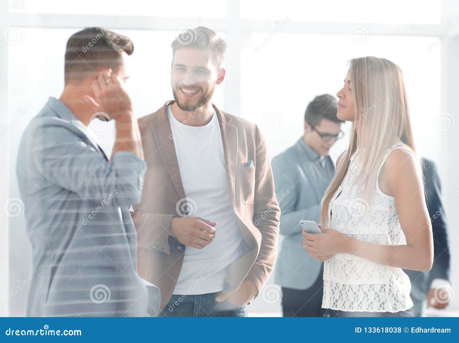 Behind the Glass.young Employees Standing in the Office Stock Photo ...