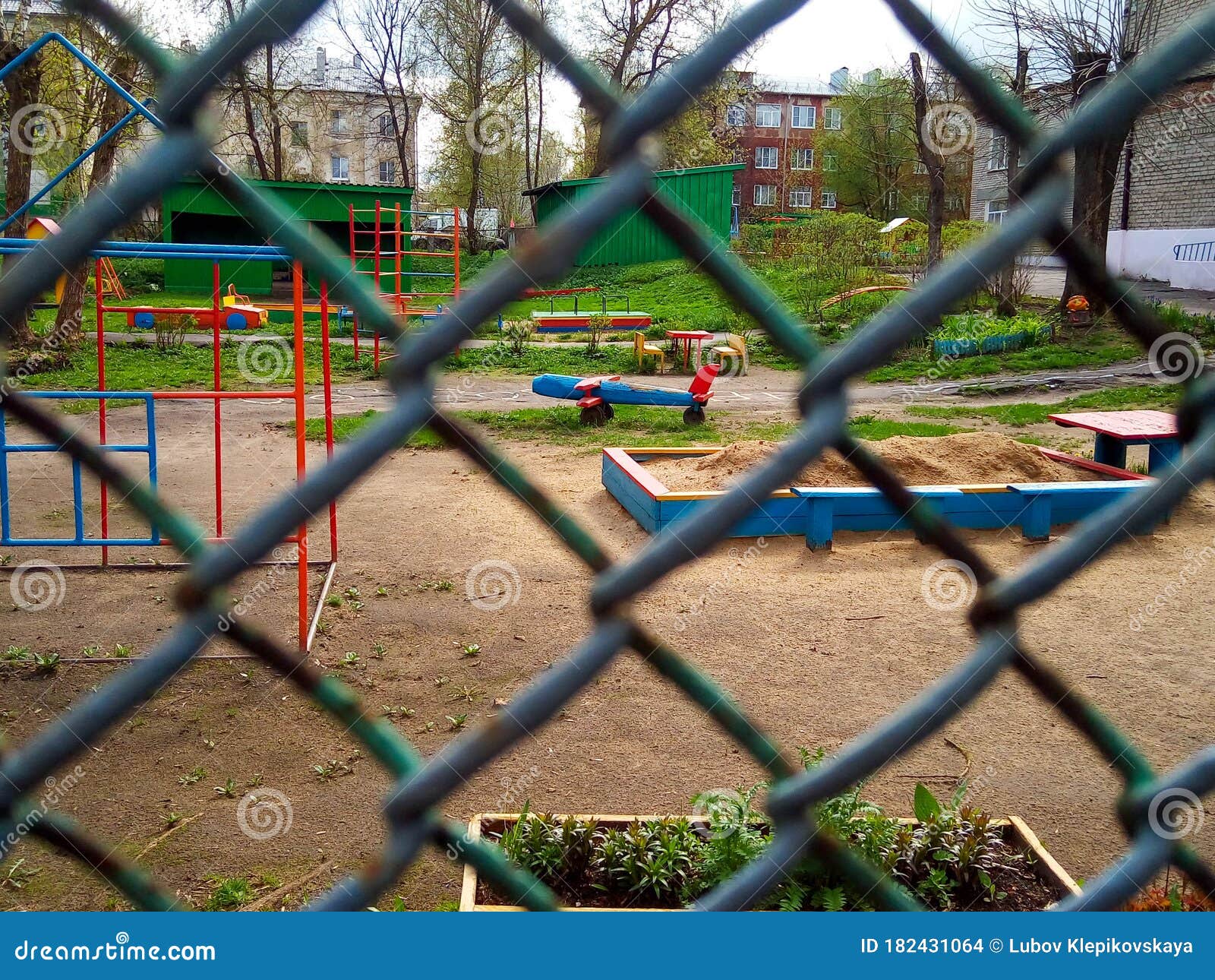 Behind the Grid is a Colorful Playground in the Kindergarten Courtyard ...