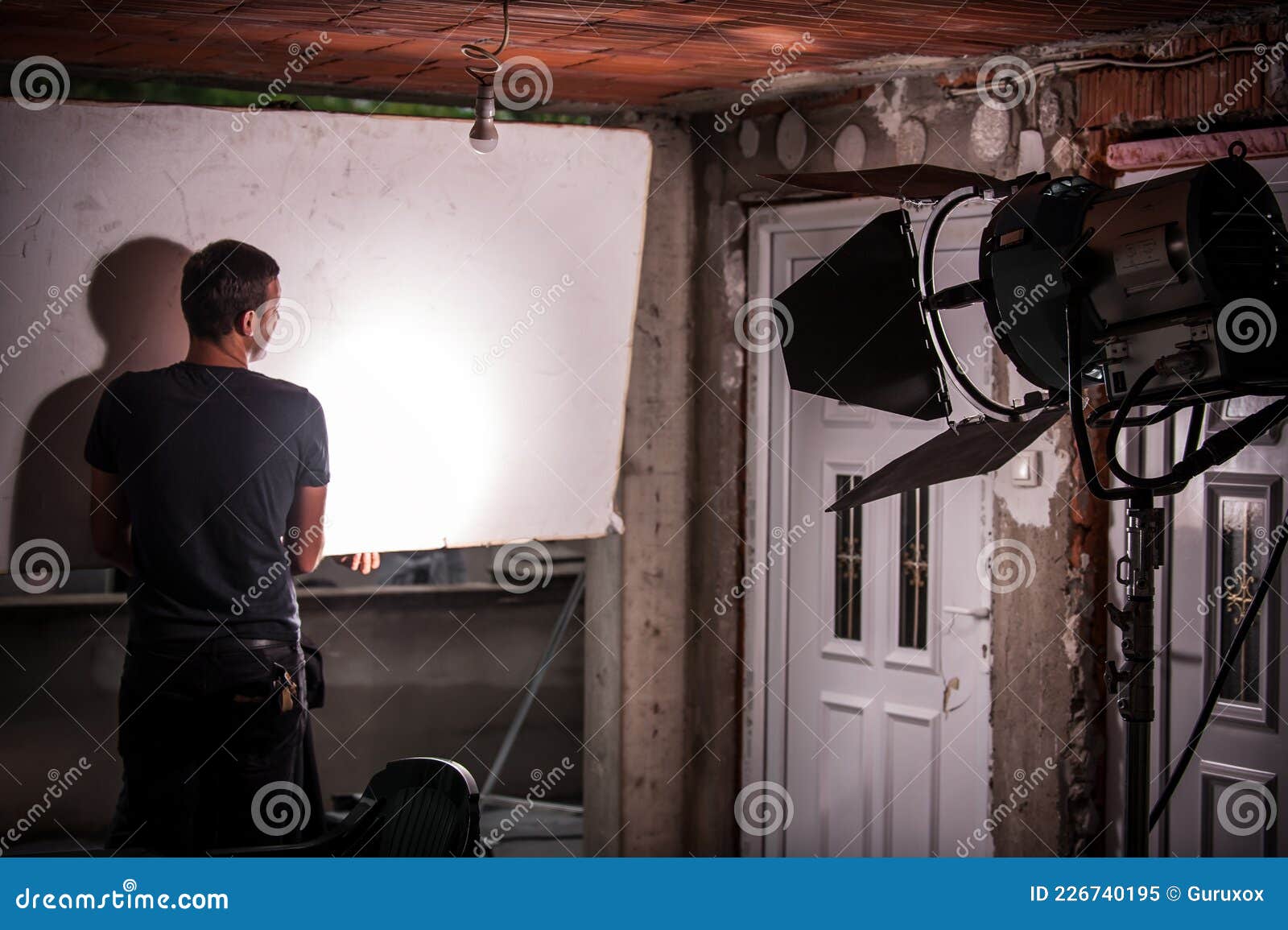 Lighting Technician Electric Engineer Adjusting Focus Of Lighting ...