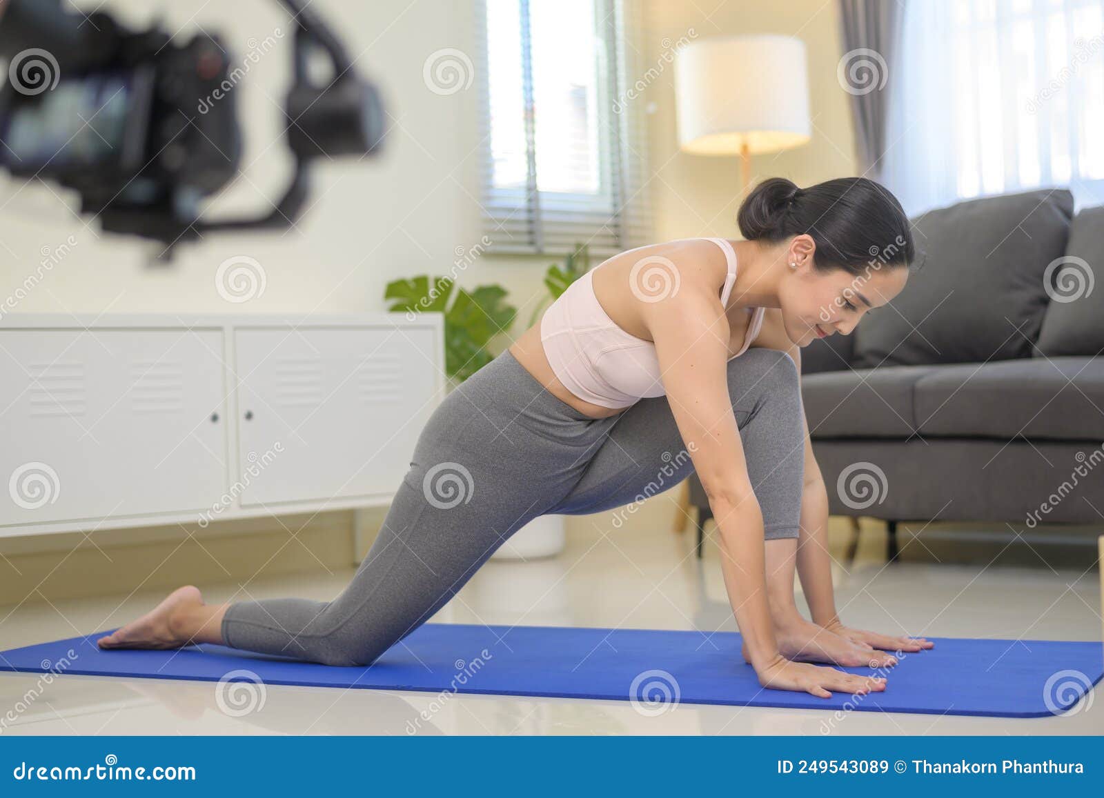 Behind The Scenes Of Fit Young Woman Doing Yoga And Meditation At Home