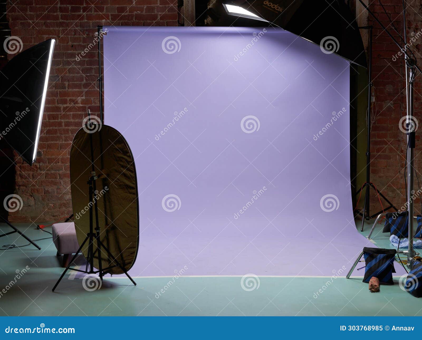 Behind-the-scenes at a Photo Shoot, the Studio Setup Includes Lighting ...