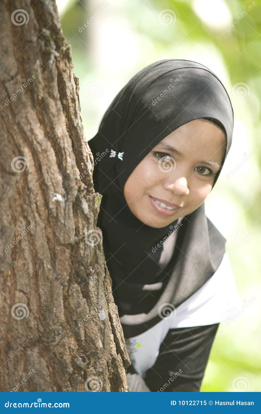 Behind the tree stock image. Image of moslem, bark, smile - 10122715