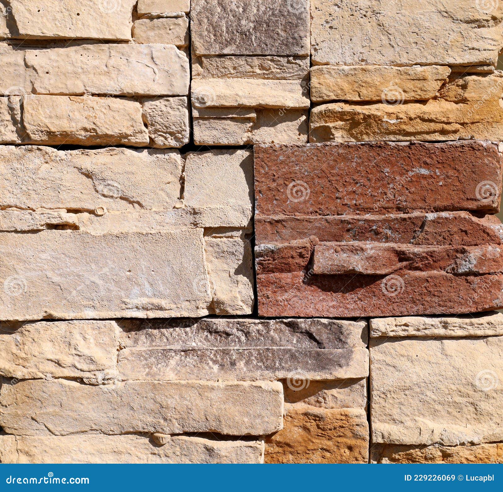 Beige and Brown Exterior Wall Cladding Made of Irregular Stone Bricks ...