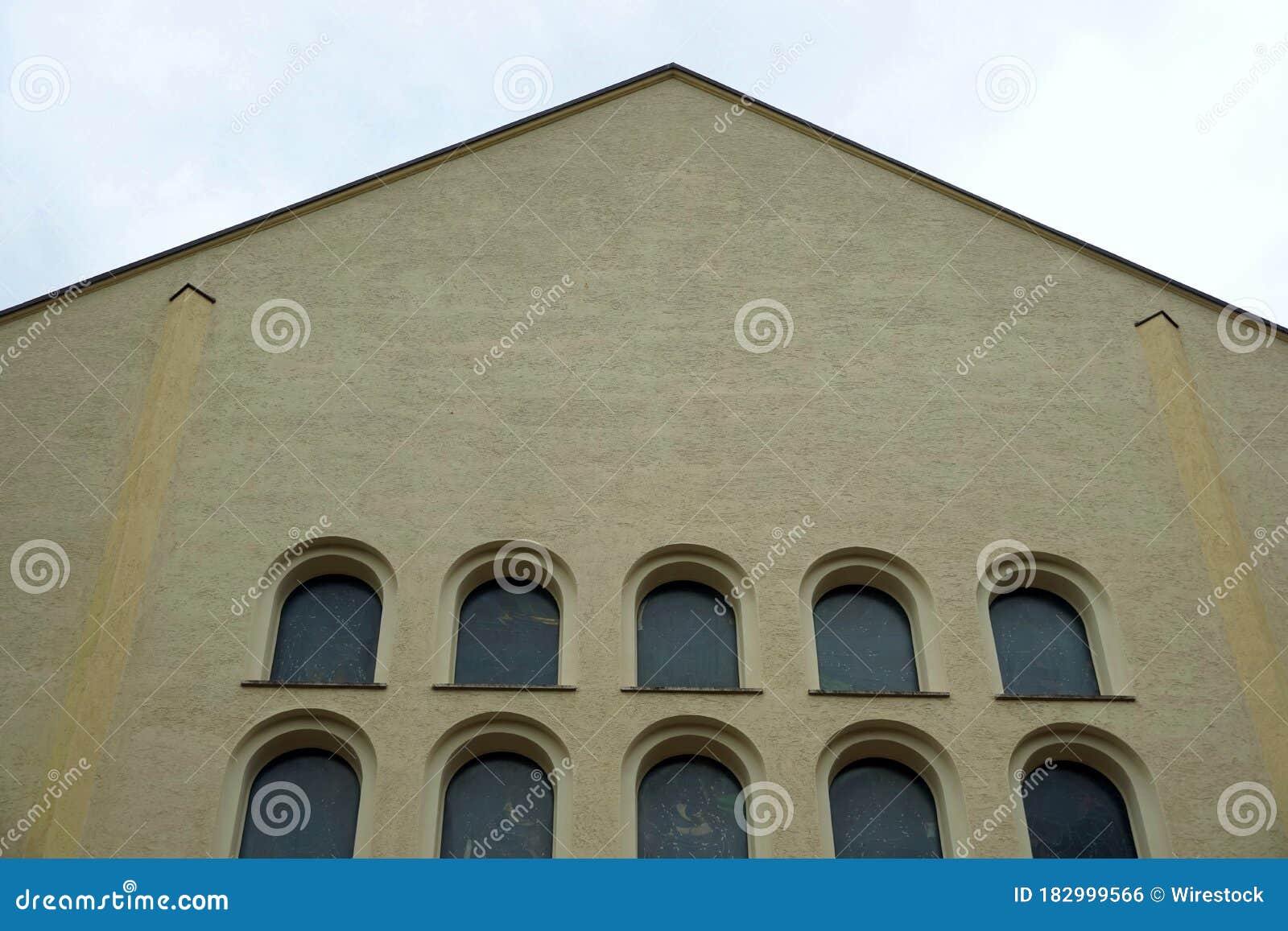 Beige Building with Many Black Windows Stock Photo - Image of blue ...