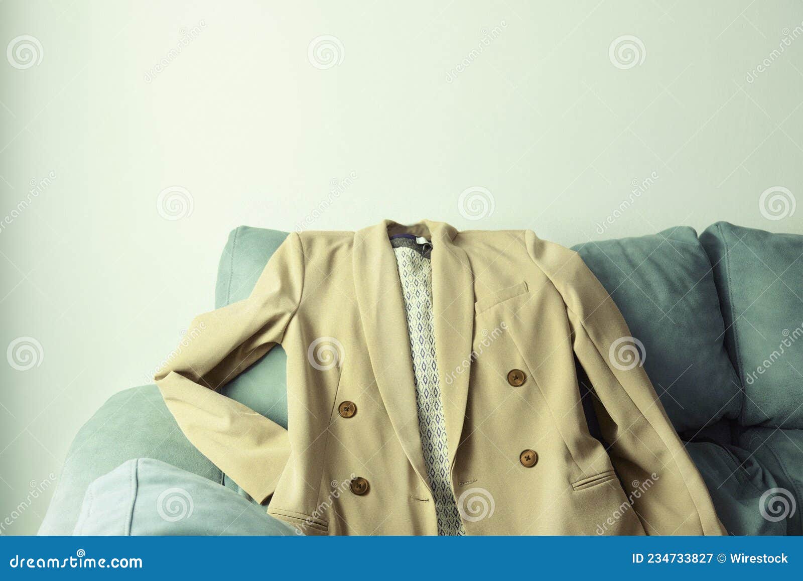 Beige Colored Suit Jacket on a Couch Stock Image - Image of style ...