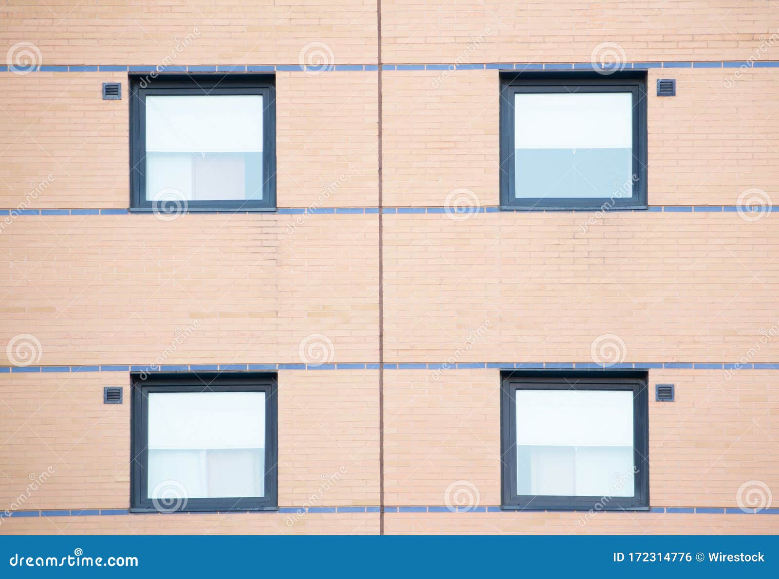Beige Facade of a Building with Four Windows Stock Photo - Image of ...