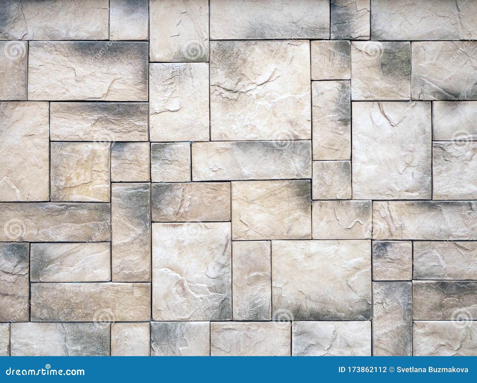 The Beige-gray Wall is Lined with Rectangular Blocks of Different Sizes ...