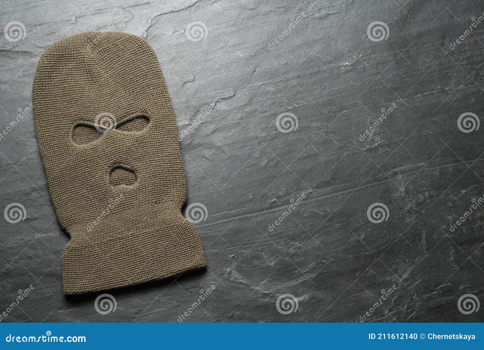 Beige Knitted Balaclava on Black Table, Top View. Space for Text Stock ...