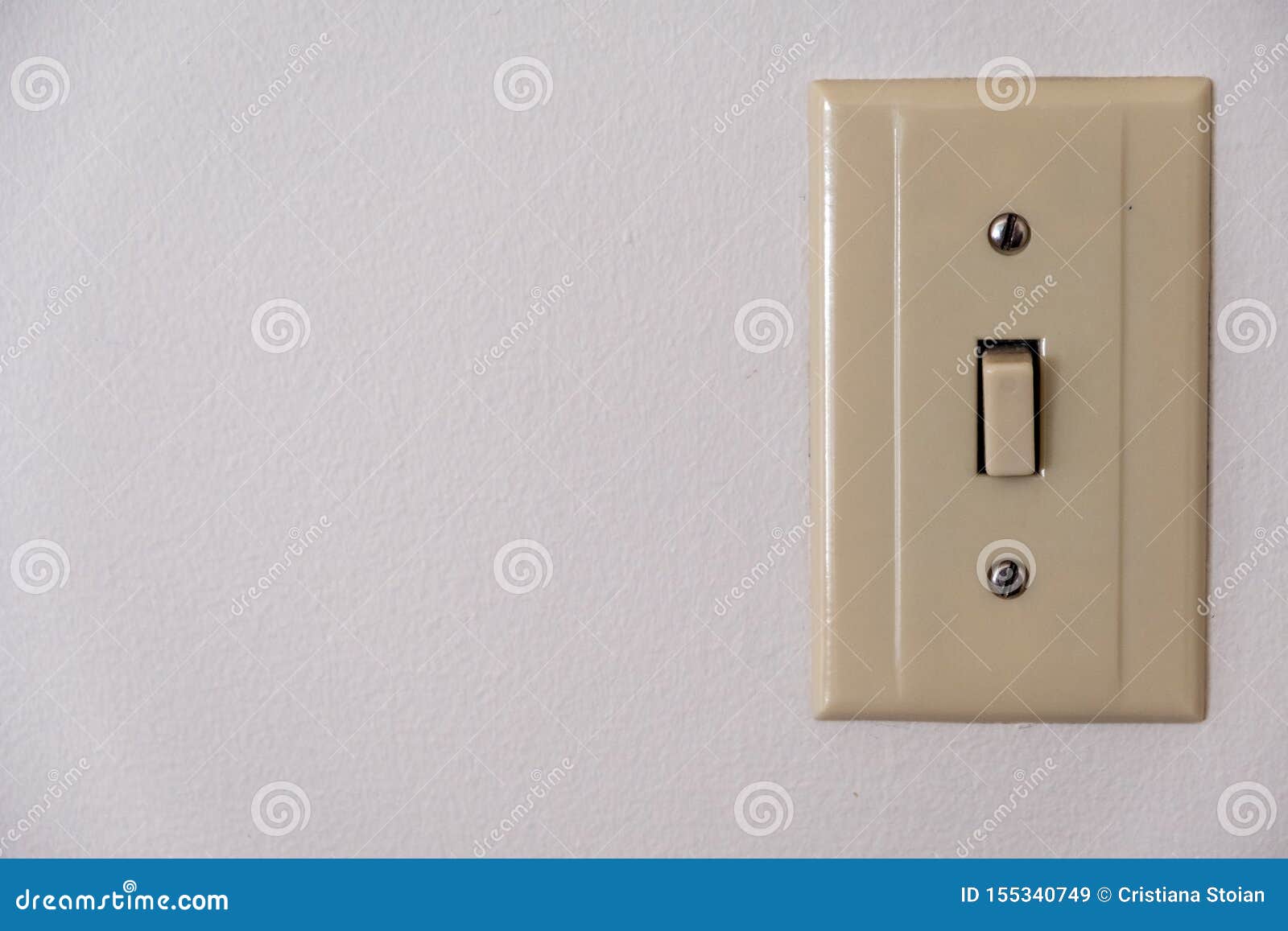 Beige, Plastic Light Switch on the Right Side of a White Wall Stock ...