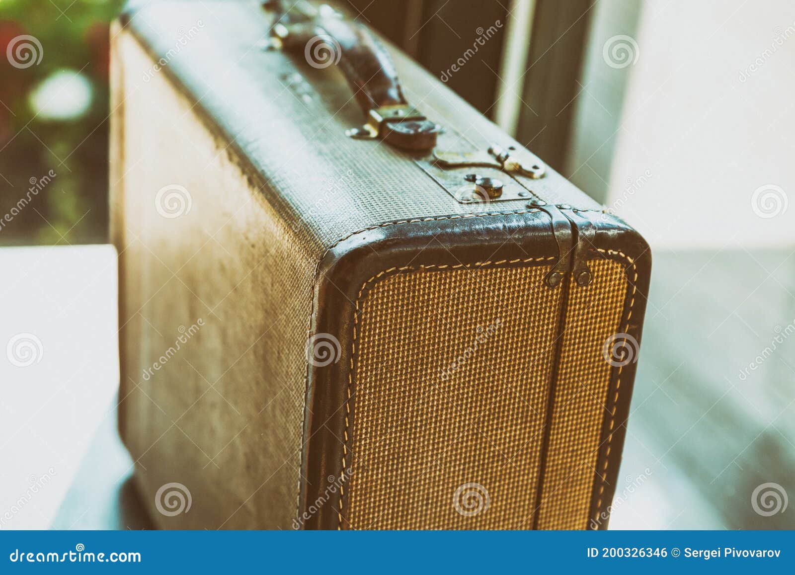 Beige Suitcase with Leather Handle in Classic Shape, Tinted Closeup ...