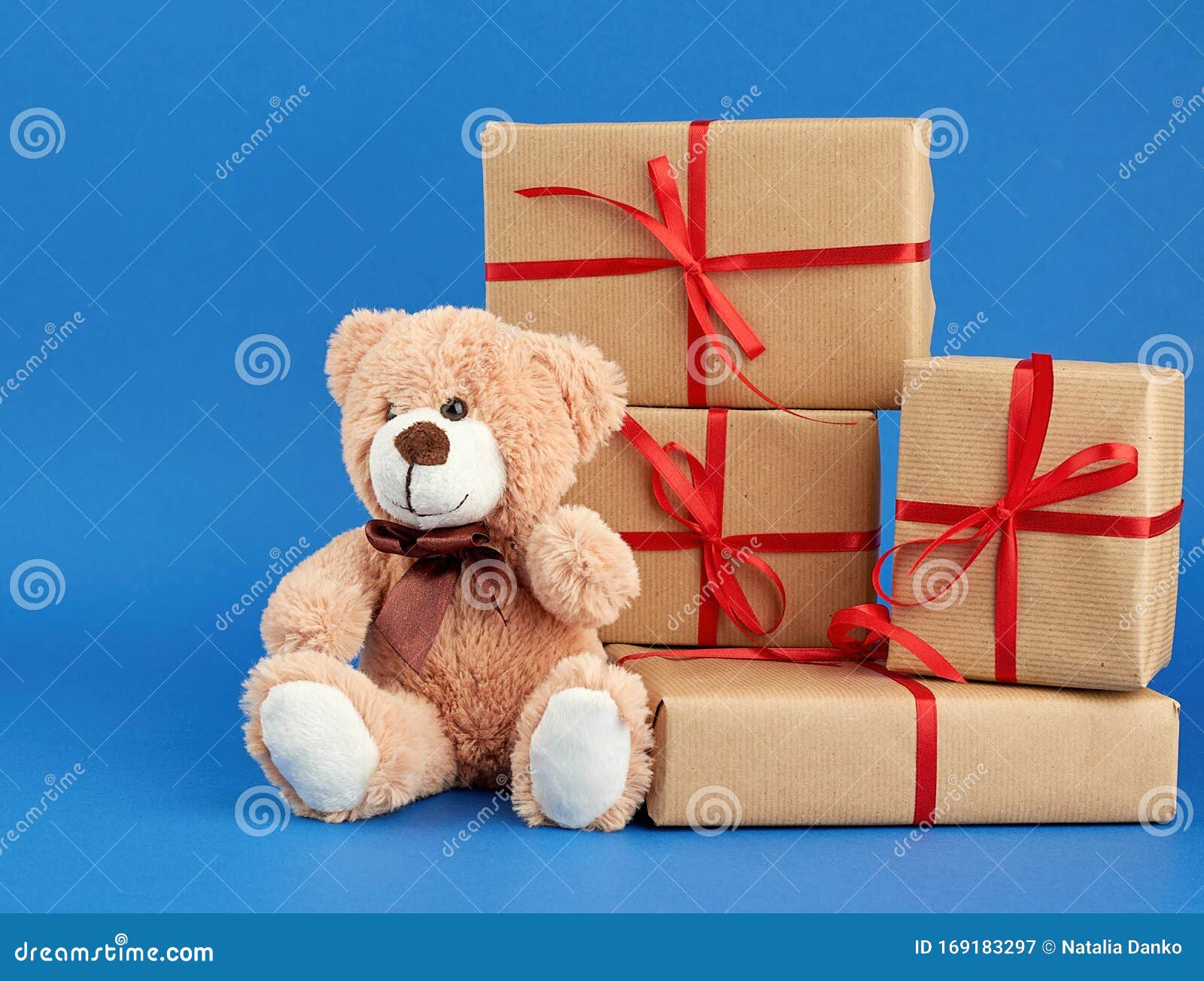 Beige Teddy Bear and a Stack of Boxes Wrapped in Brown Kraft Paper and ...