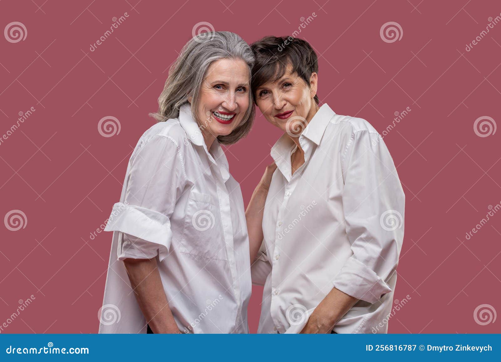 Two Mature Women in White Shirts Looking Confident Stock Image - Image ...