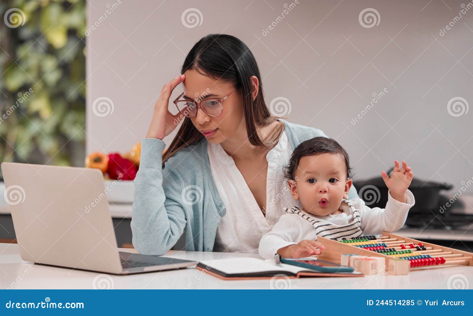 Being a Mother is Hard Work. Shot of a Young Mother Looking Stressed ...