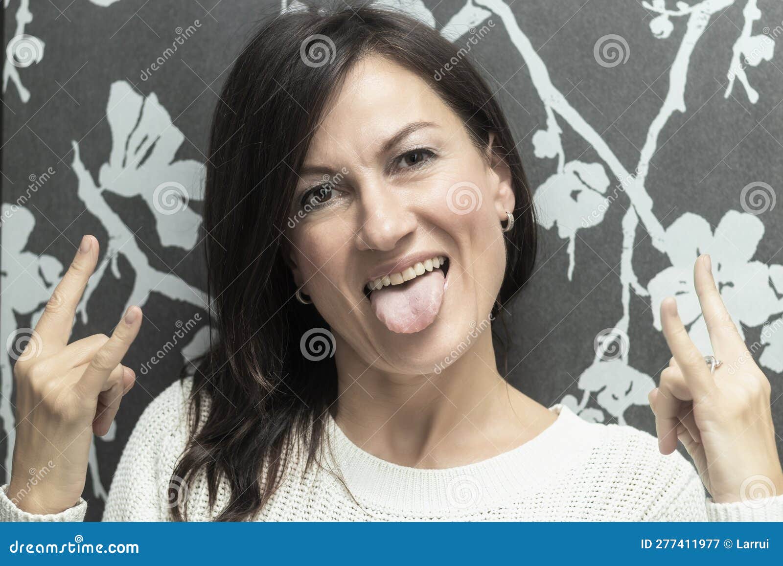 Being Playful And Mischievous Woman Sticks Out Her Tongue And Makes