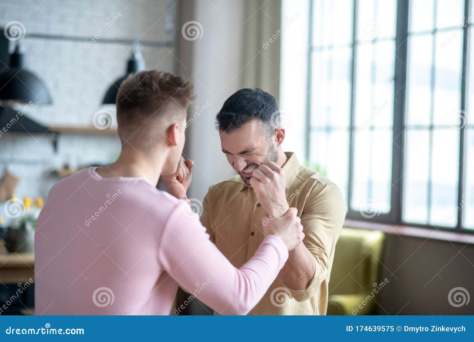 Two Young Men Fighting and Looking Agressive Stock Image - Image of ...