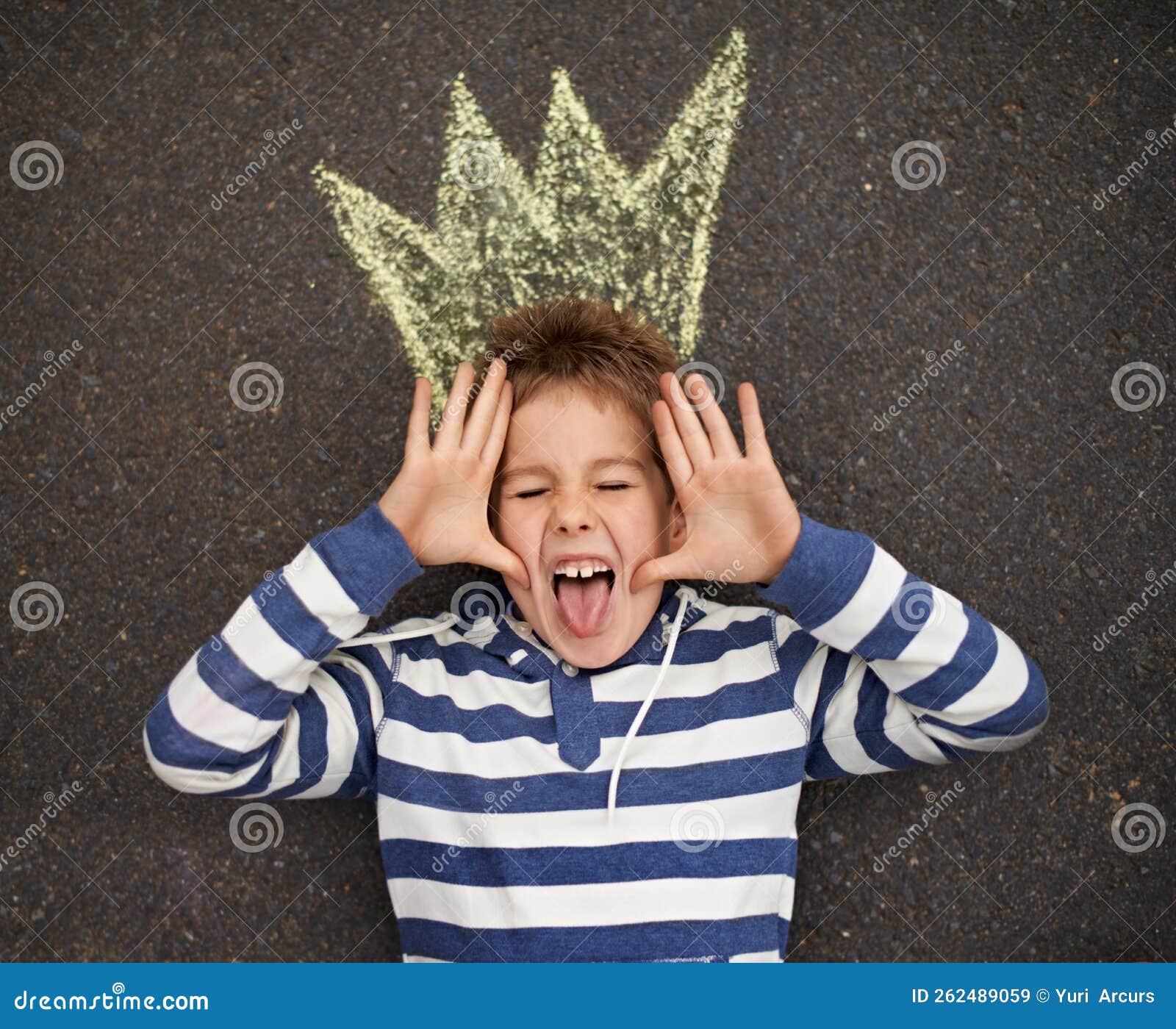 Being a Silly Billy. Top View Shot of a Young Boy Lying on the Ground ...
