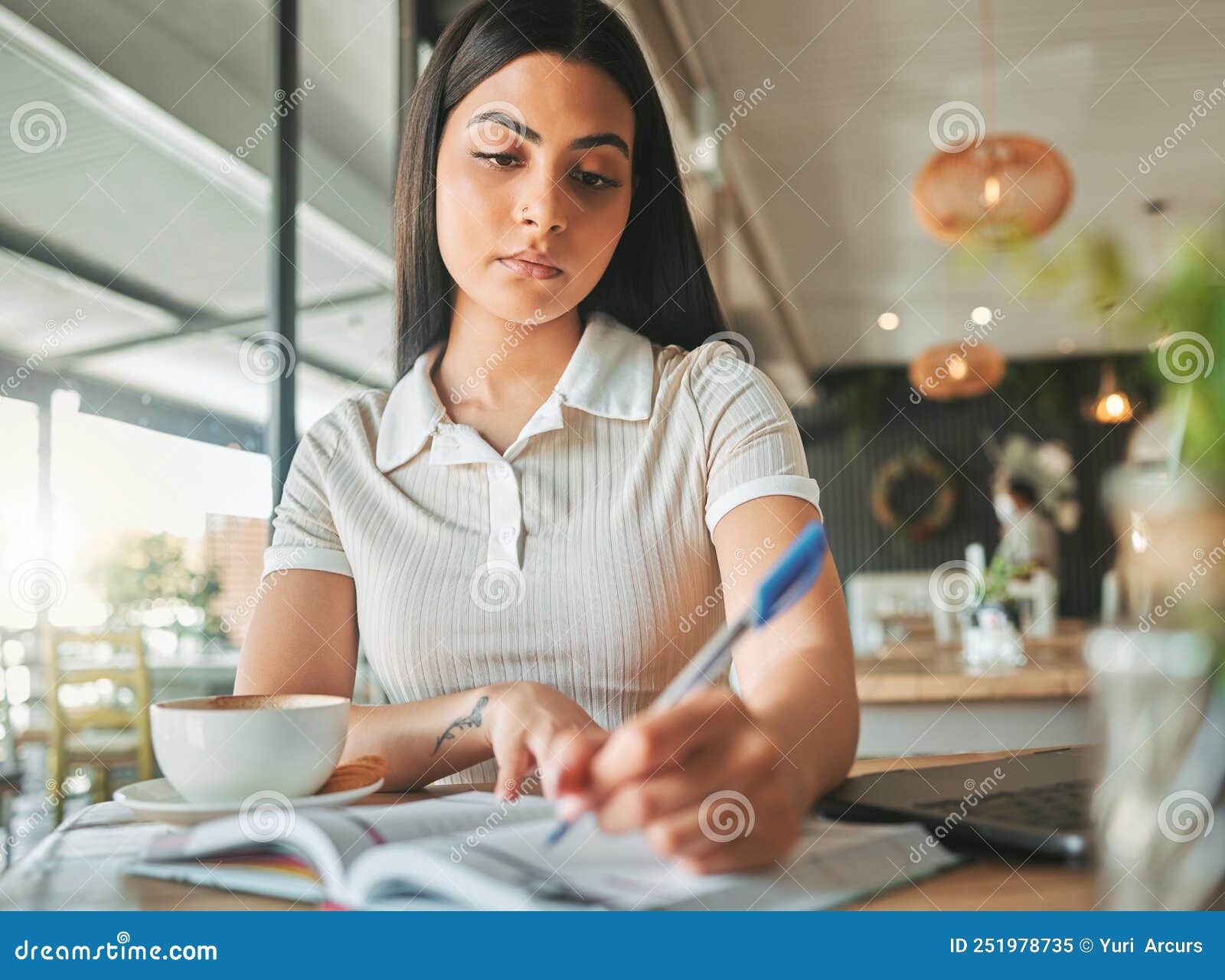 Being a Student Requires Dedication. a Young Female Student Working in ...