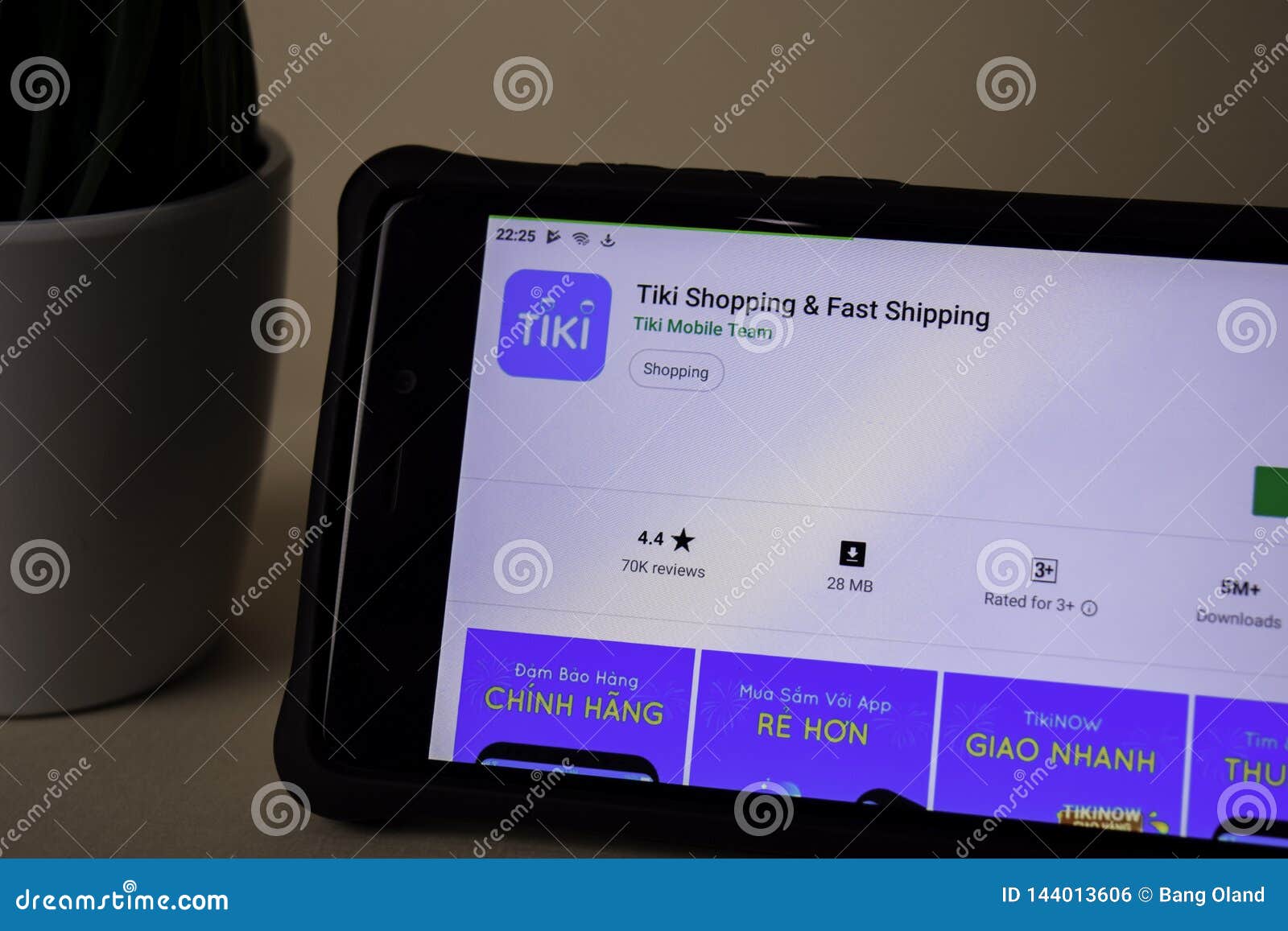 Tiki Shopping Dev Application on Smartphone Screen. Fast Shipping is a ...