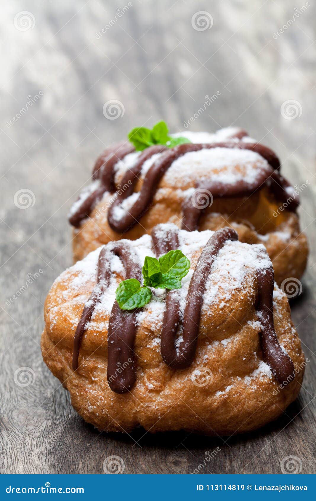 Belgian Chocolate Choux Buns on Wooden Table Stock Image - Image of ...