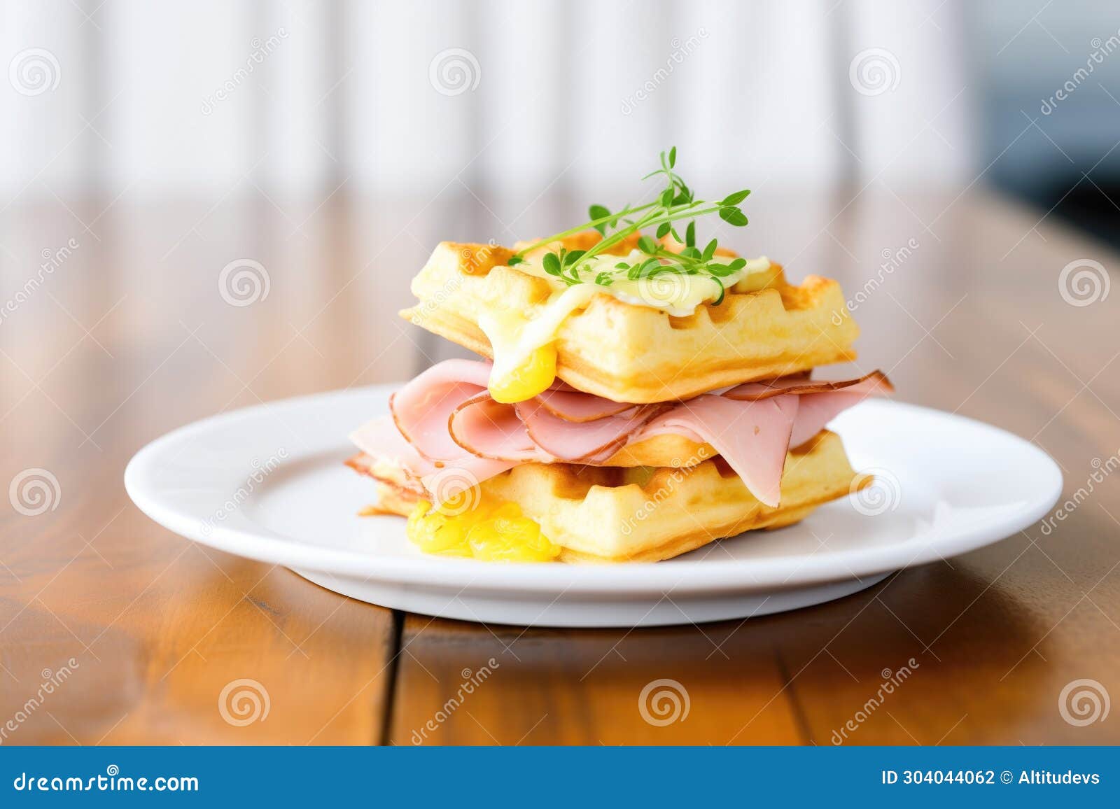 Belgian Waffle Breakfast Sandwich with Ham and Cheese Stock Photo ...