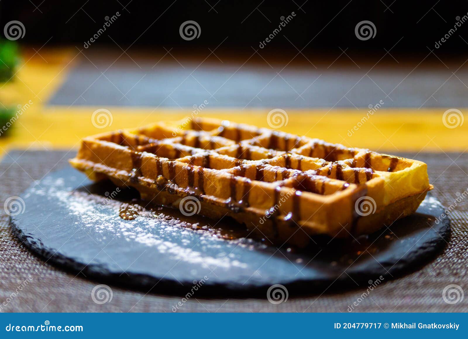 Belgian Waffle with Chocolate Syrup and Powdered Sugar Stock Image ...
