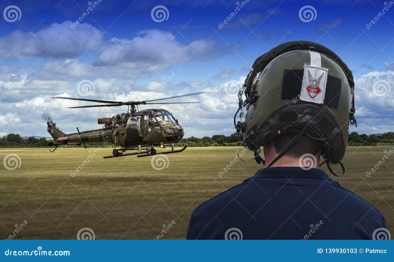 A Bell Helicopter Landing in a Field. Editorial Stock Photo - Image of ...