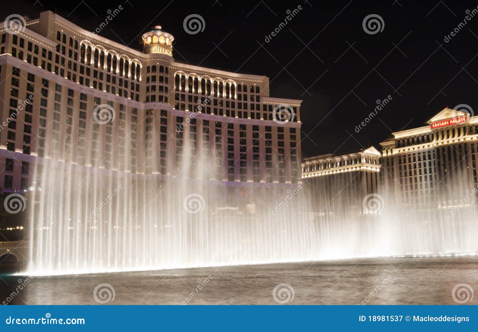 Water Show In The Pool And Night View Of The Skylines Near The Burj ...