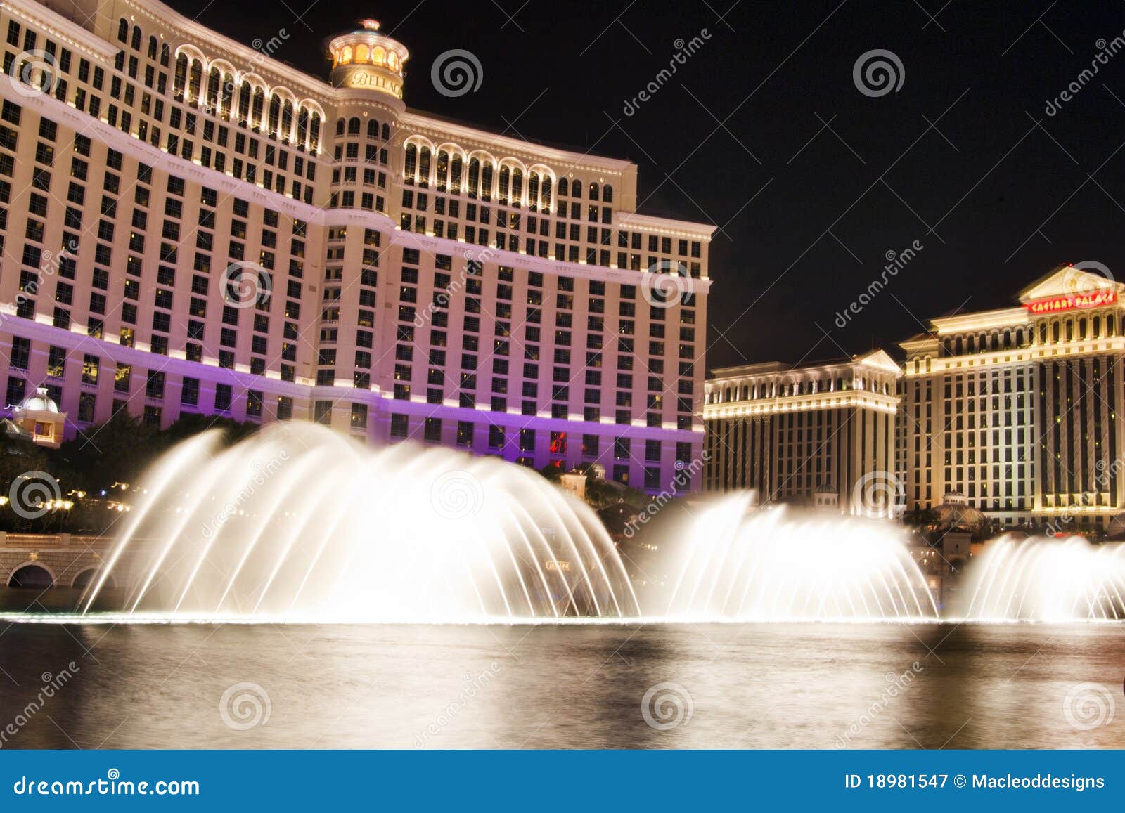 Water Show In The Pool And Night View Of The Skylines Near The Burj ...