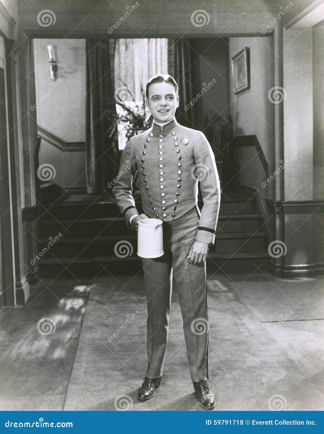 Bellboy holding pitcher stock photo. Image of full, caucasian - 59791718