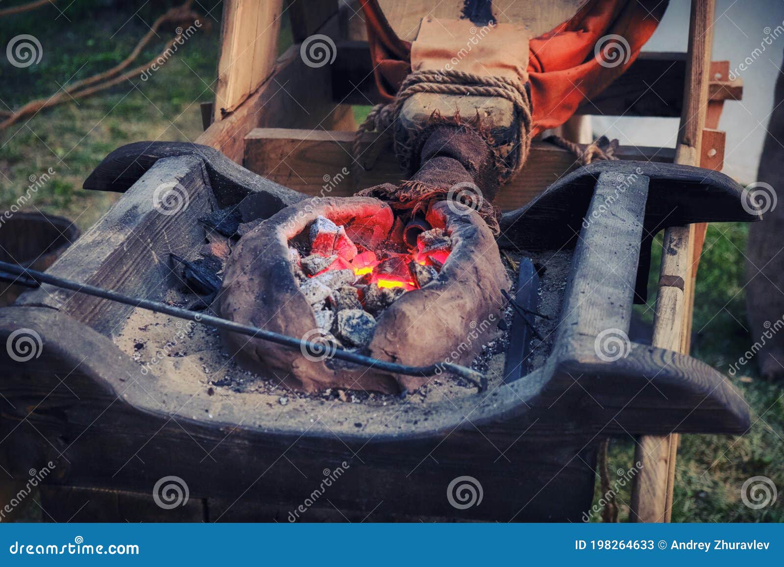 The Bellows of the Blacksmith Fanning the Fire in the Coals. Evening ...
