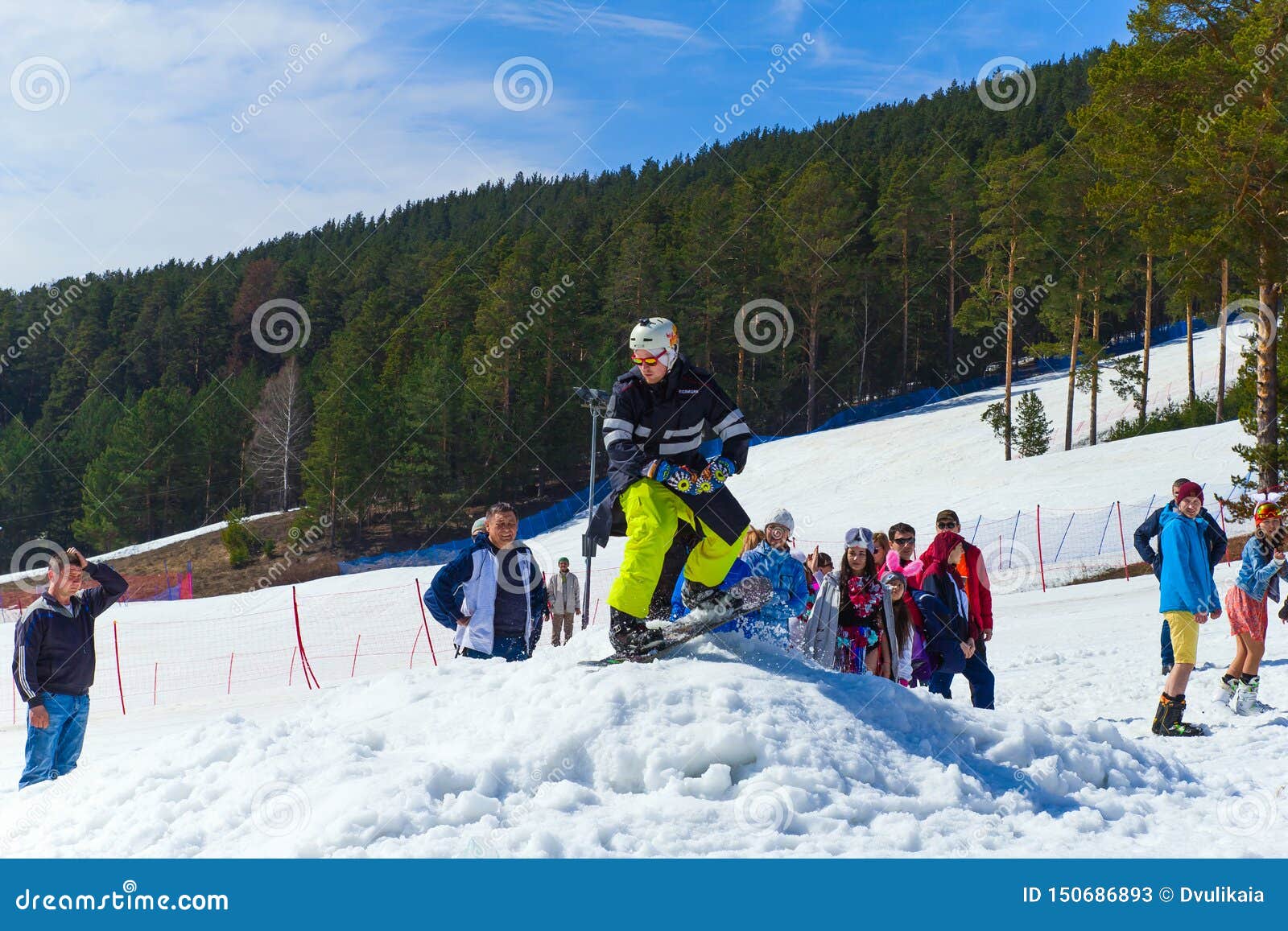 BELORETSK,RUSSIA, 13 APRIL 2019 Man on Snowboard Makes a Jump on a Ski ...