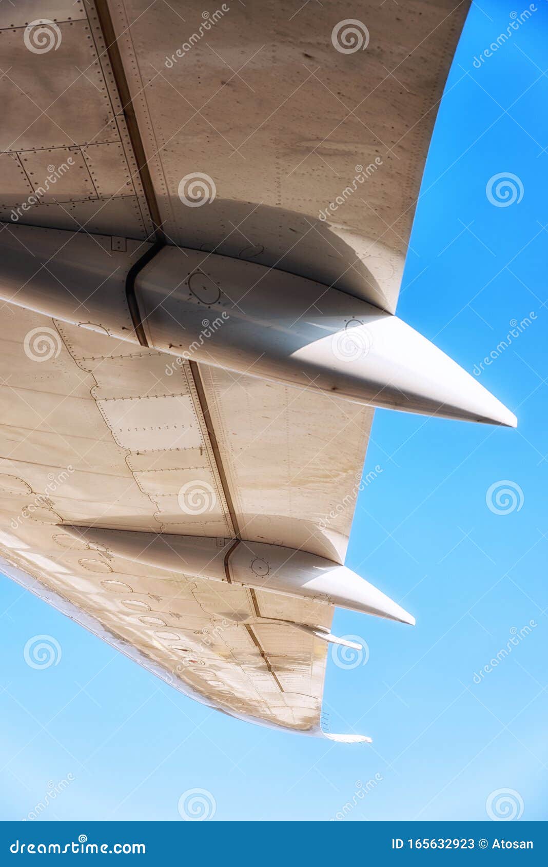 Below an Aircraft Wing stock image. Image of airport - 165632923