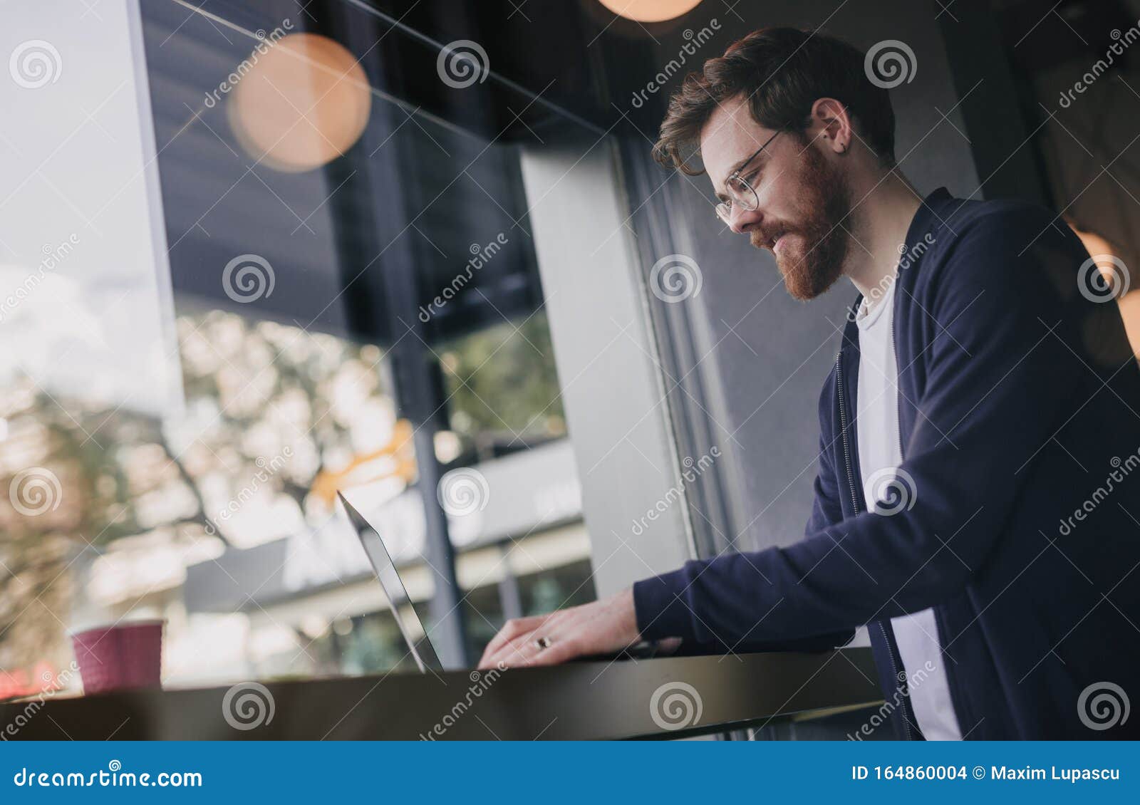 Inspired Man Working on Laptop at Table Stock Photo - Image of ...
