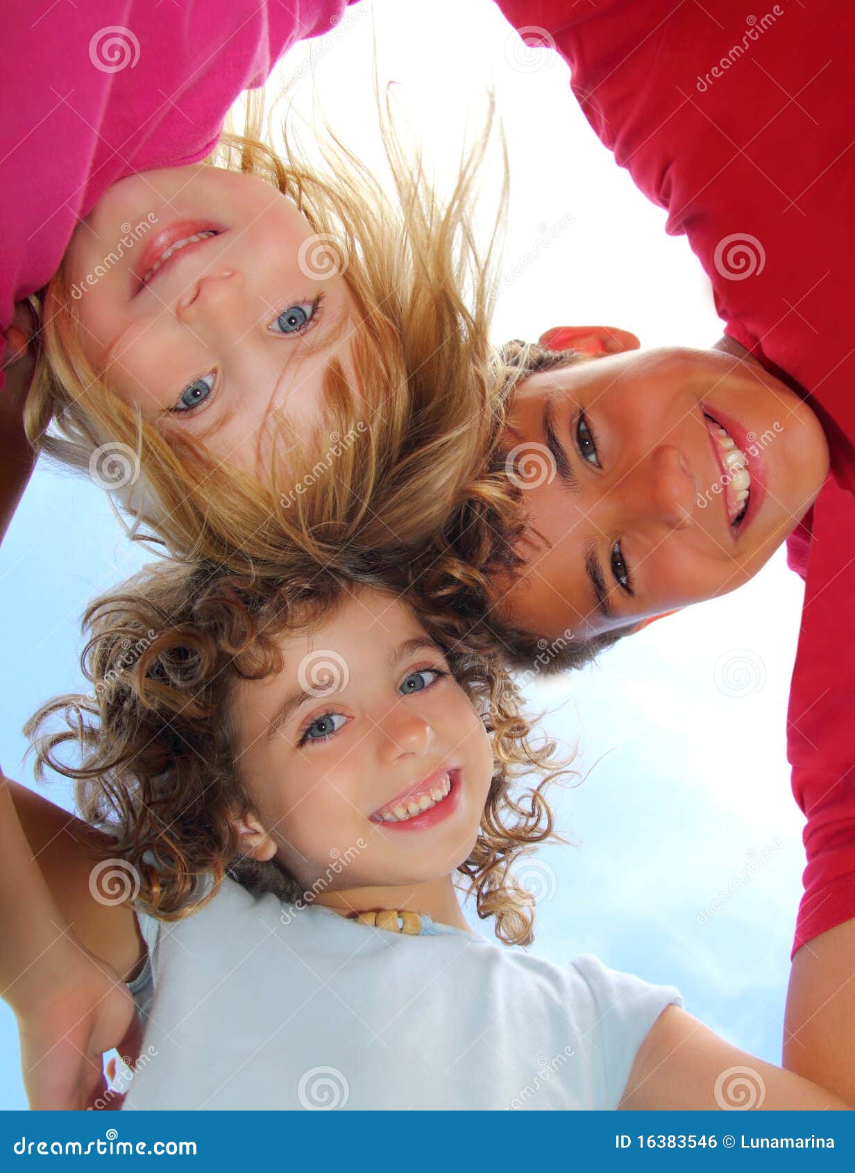 Below View of Happy Three Children Embracing Stock Photo - Image of ...