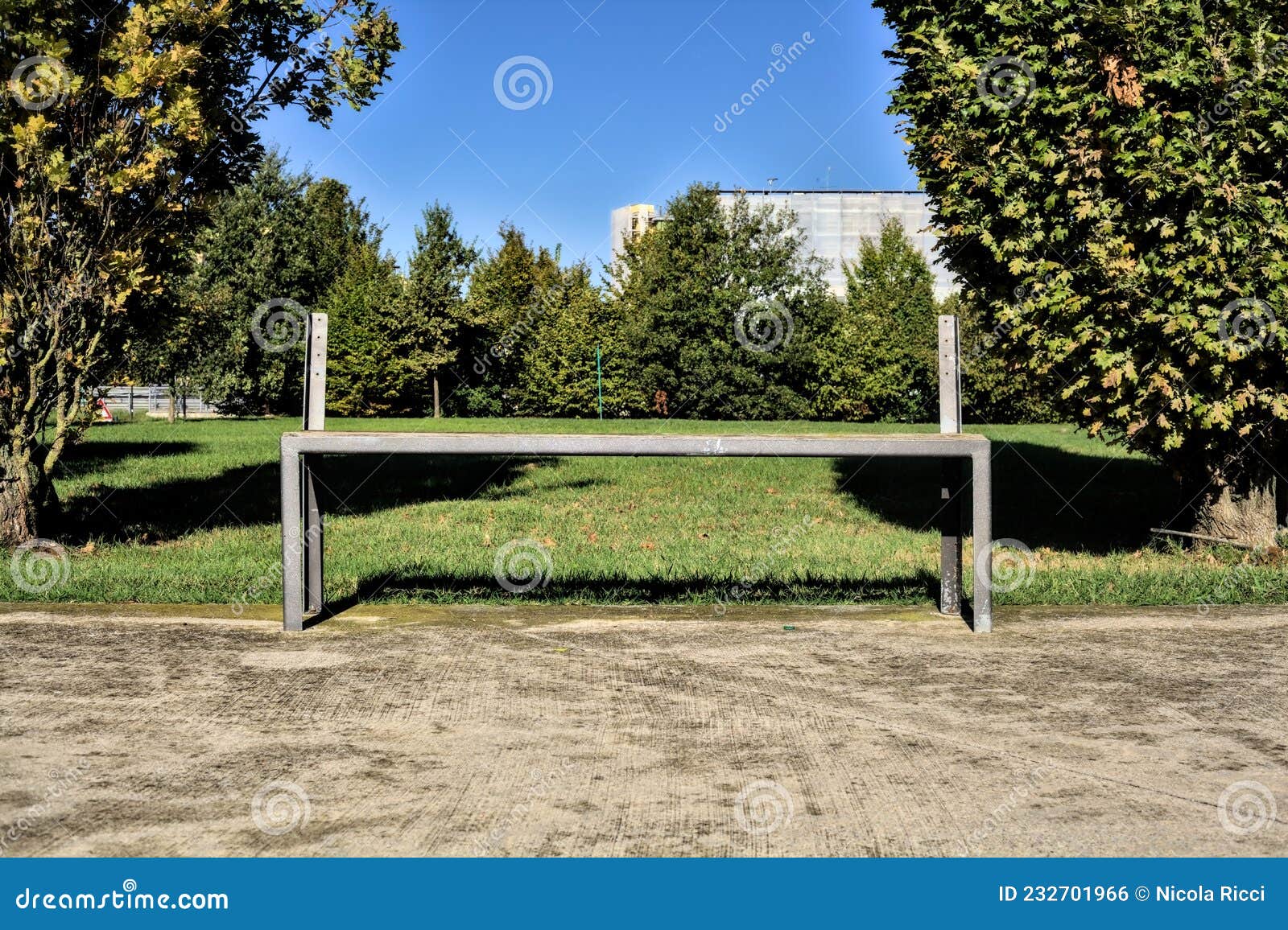 Bench without Backrest in a Park on a Clear Day Stock Photo - Image of ...