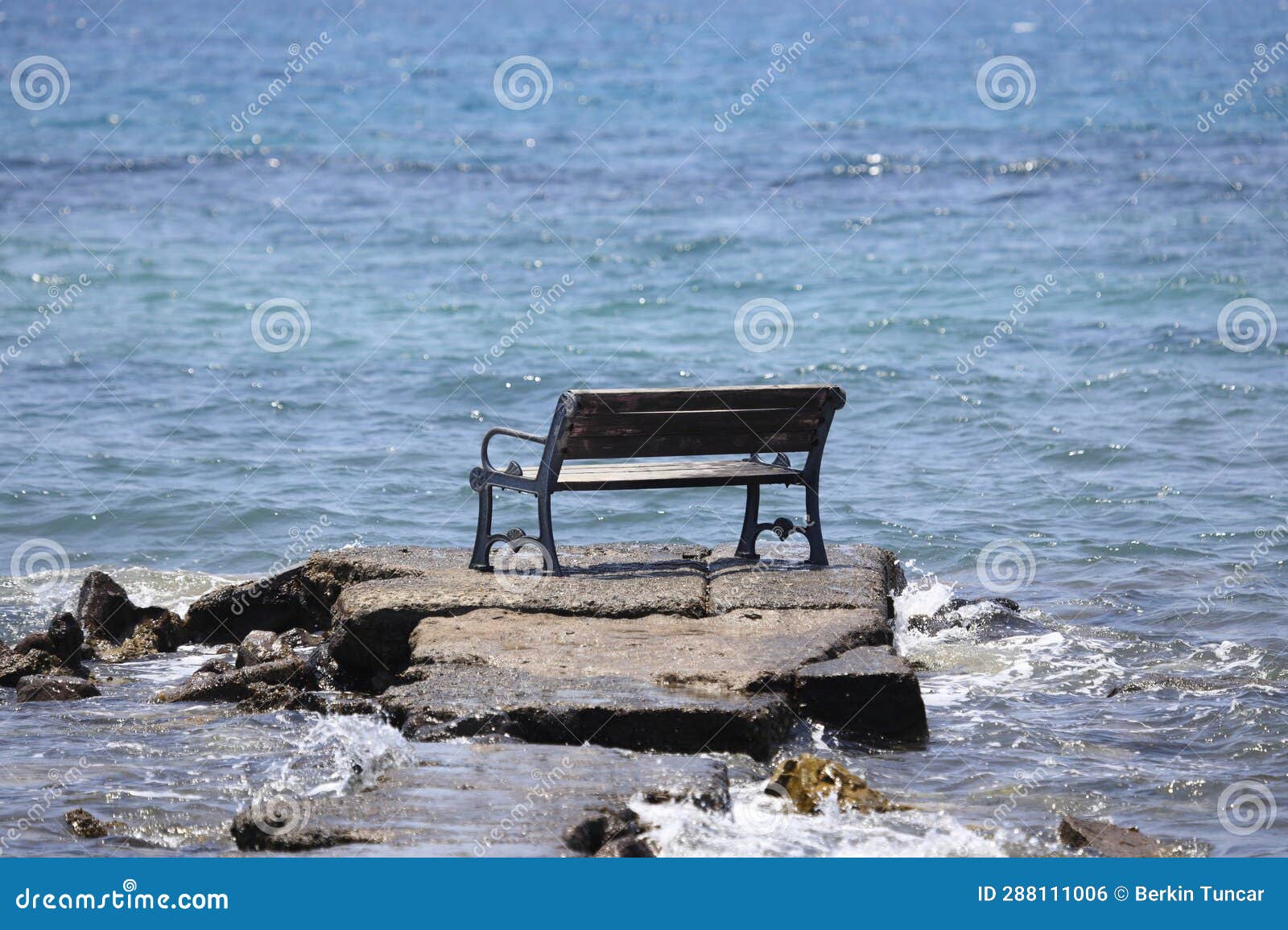 Bench on the Beach. a Lonely Bench on the Shore of the Deep Blue Aegean ...