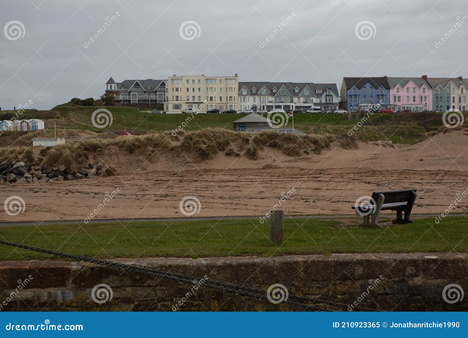A Bench on the Canal Wall at Bude, Cornwall with the Beach in the ...