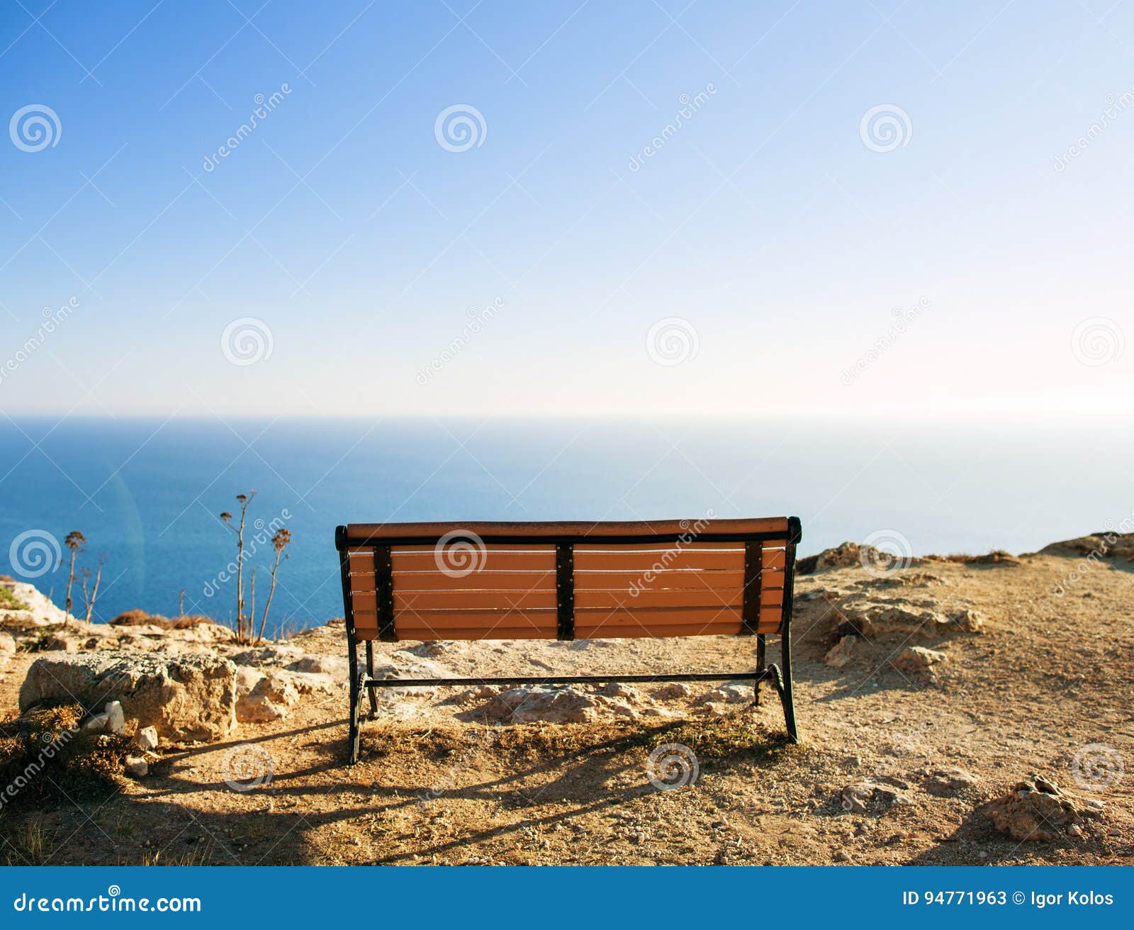 Bench at the edge stock image. Image of sunlight, dramatic - 94771963