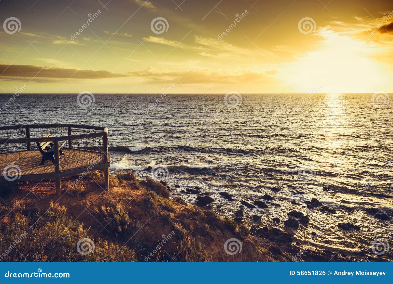 Bench on the Edge of the Rock at Sunset Stock Photo - Image of ...