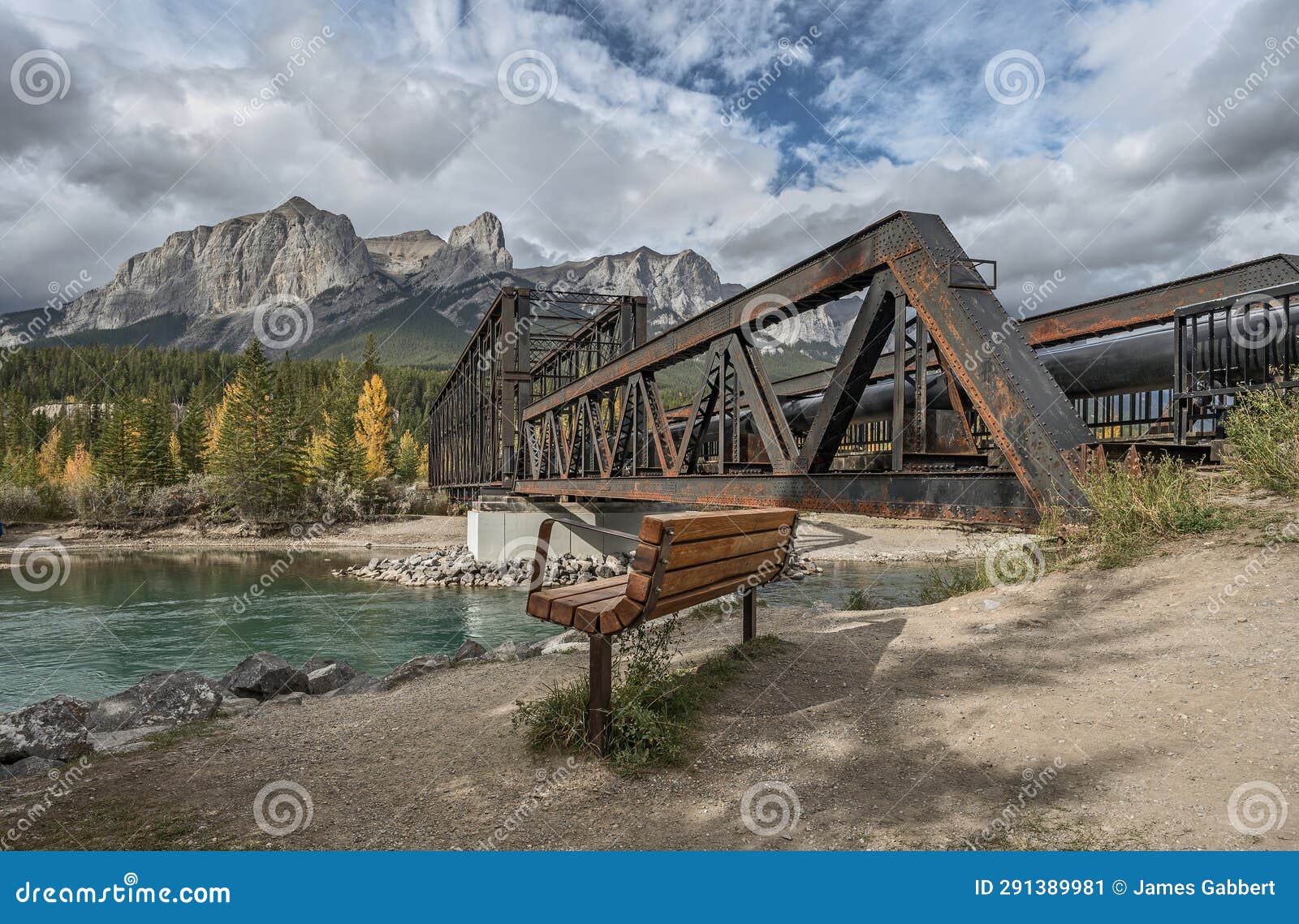 Bench an Engine Bridge in Canmore Stock Image - Image of river ...