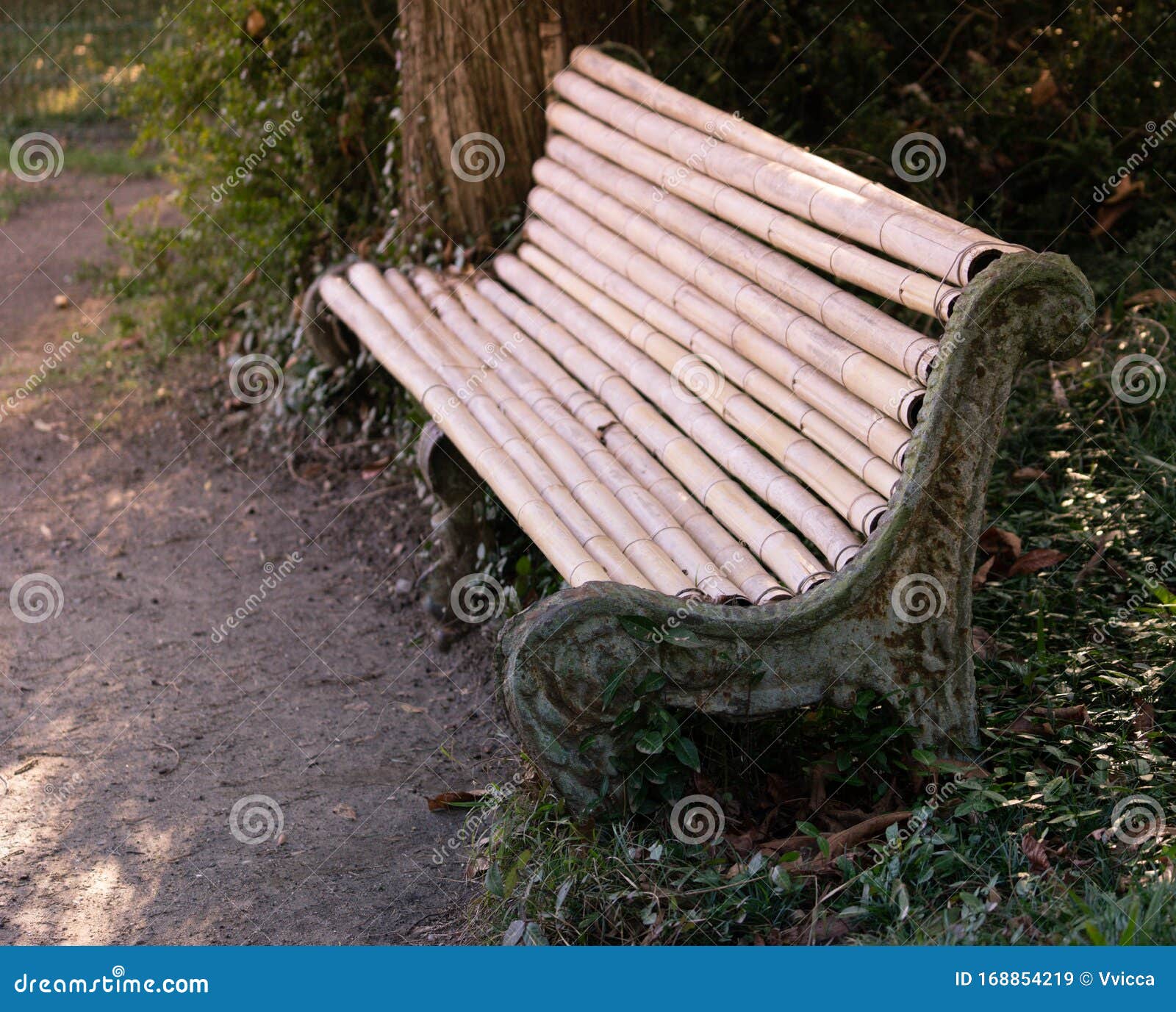 Bench Made of Bamboo Logs on the Background of the Park Stock Image ...