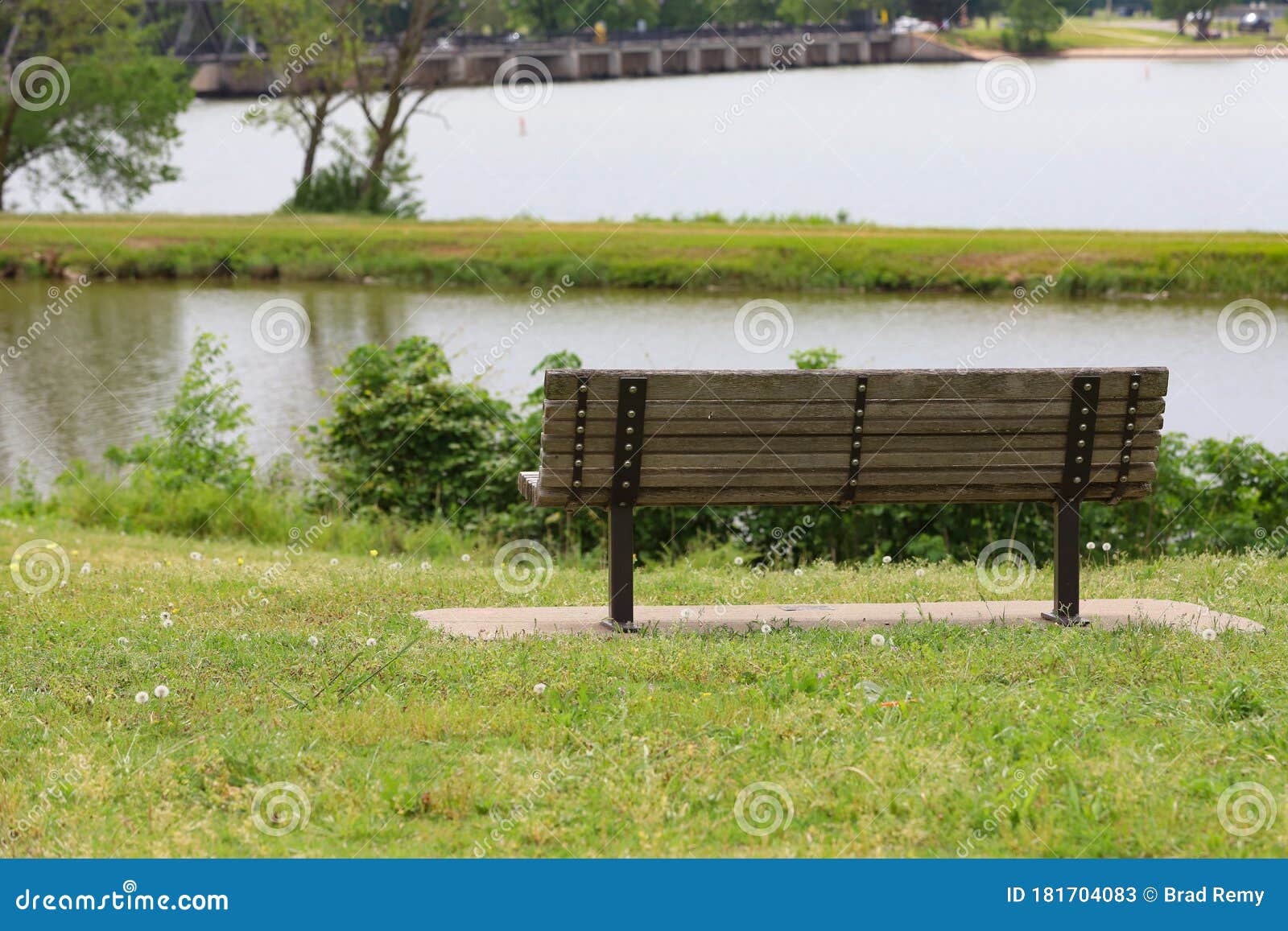 Bench overlooking a lake stock image. Image of peaceful - 181704083