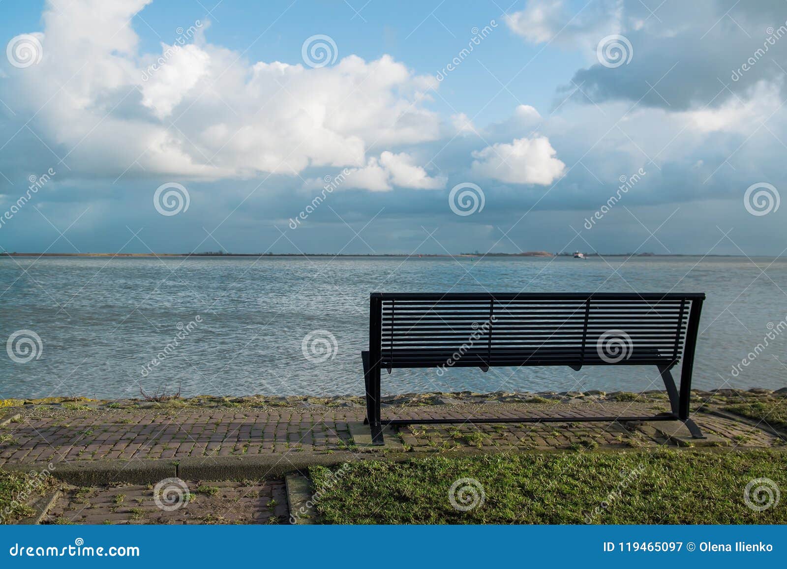 Bench Overlooking the Sea with Clouds Stock Image - Image of loneliness ...