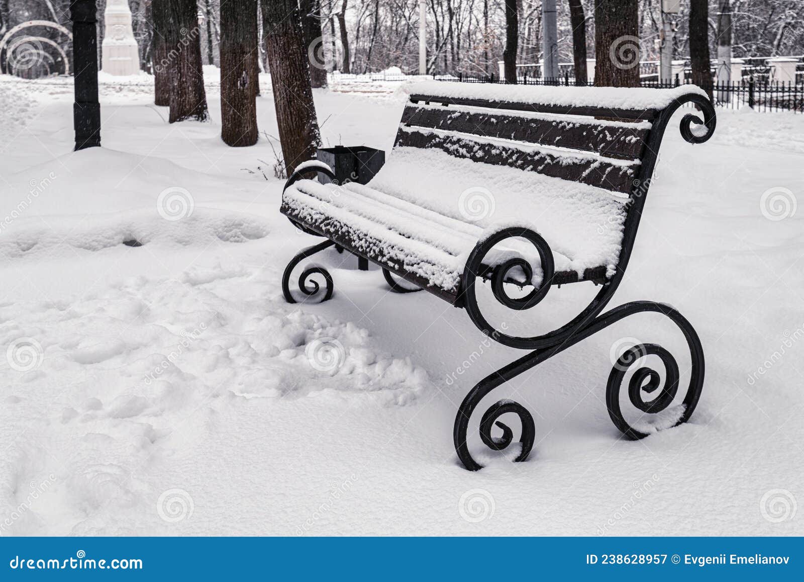 A Bench in the Park Covered with Snow in Winter Stock Image - Image of ...