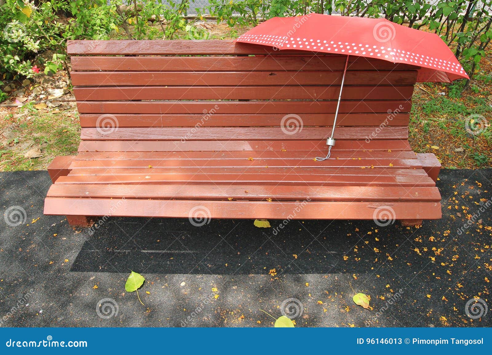 Bench with red umbrella stock image. Image of light, umbrella - 96146013